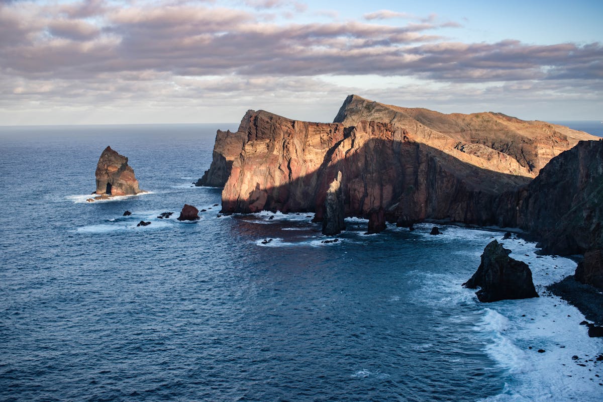 Aerial view of Madeira cliffs at sunset with golden light