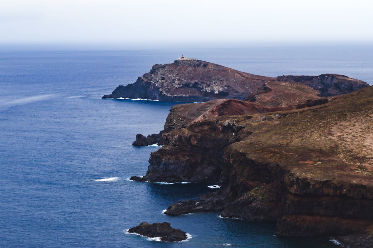 Rocky coastal cliffs near Funchal Madeira with ocean waves