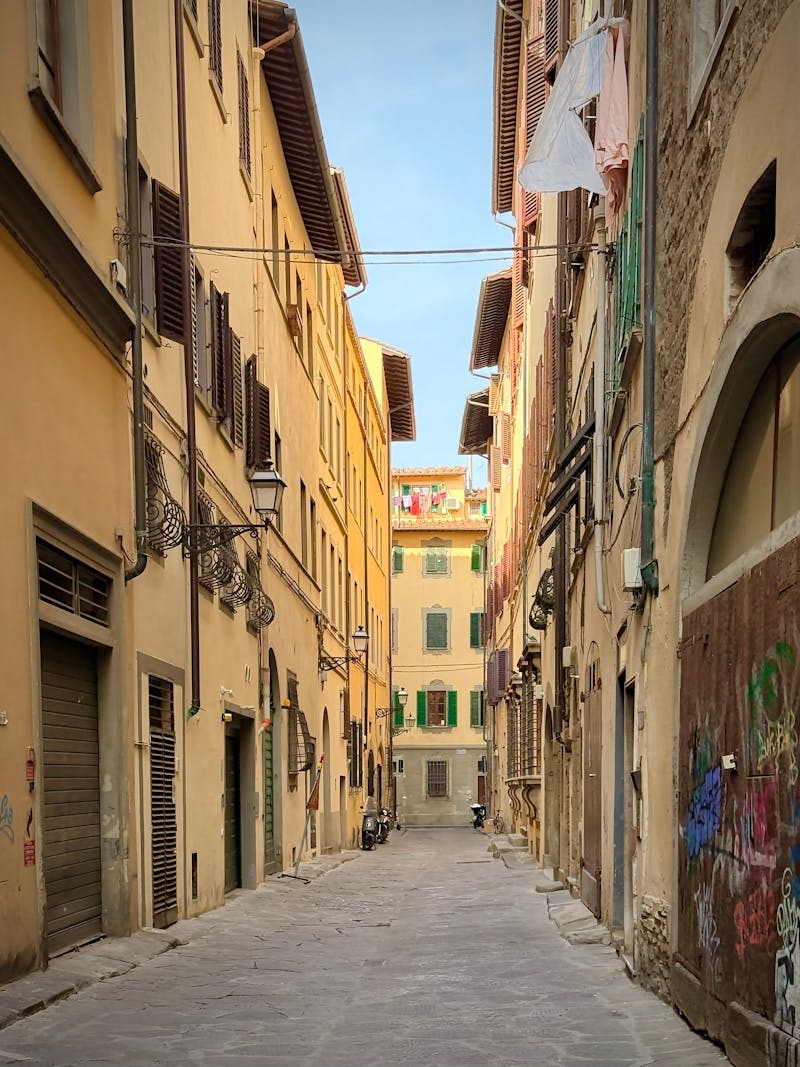Charming narrow cobblestone street in Florence Italy showcasing historic Renaissance architecture