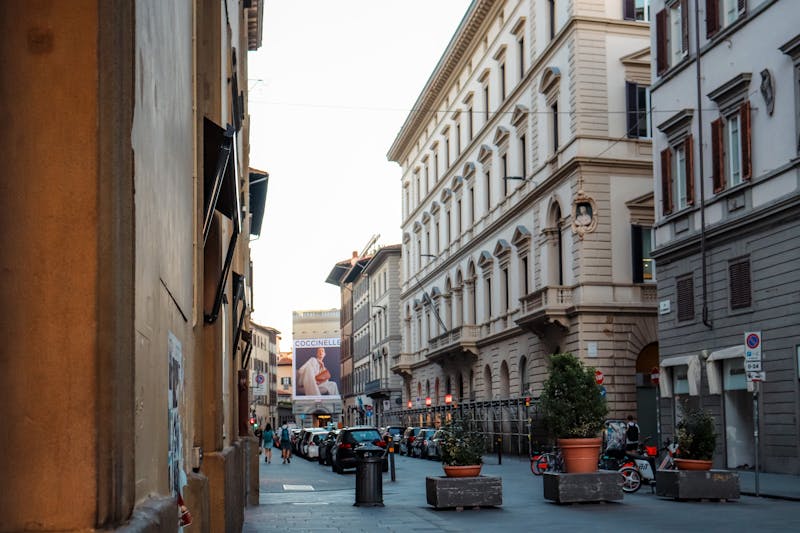 Narrow Florence street lined with classic Italian buildings