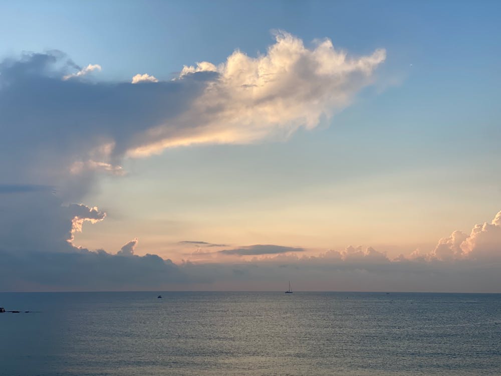 Tranquil dawn scene over the Mediterranean Sea near Barcelona with dramatic clouds