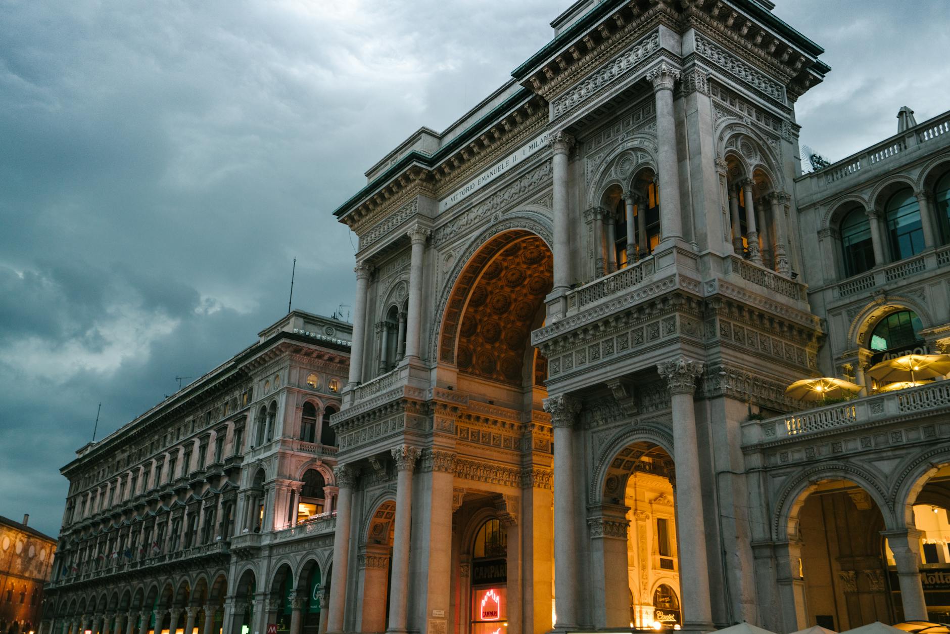 Galleria Vittorio Emanuele II illuminated at evening in Milan