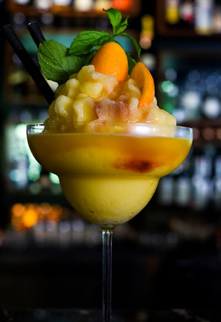 Chilled tropical cocktail with vibrant fruit garnish