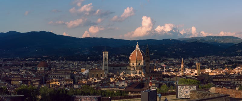 Florence cityscape at sunset with the Duomo and Palazzo Vecchio visible
