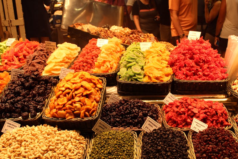 Colorful dried fruits on display at a market in Barcelona
