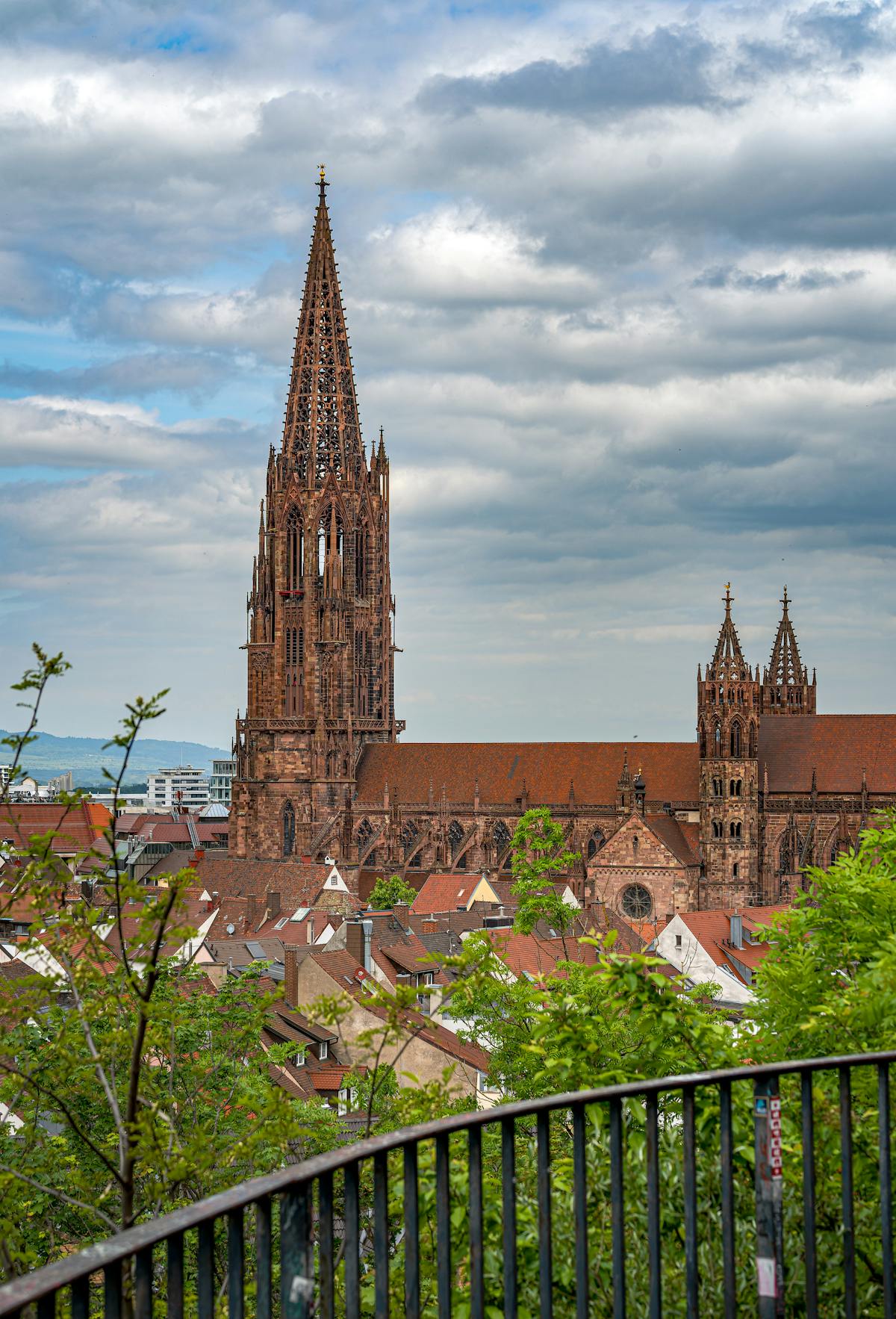 Stunning Gothic architecture of Freiburg Minster overlooking vibrant cityscape in Germany