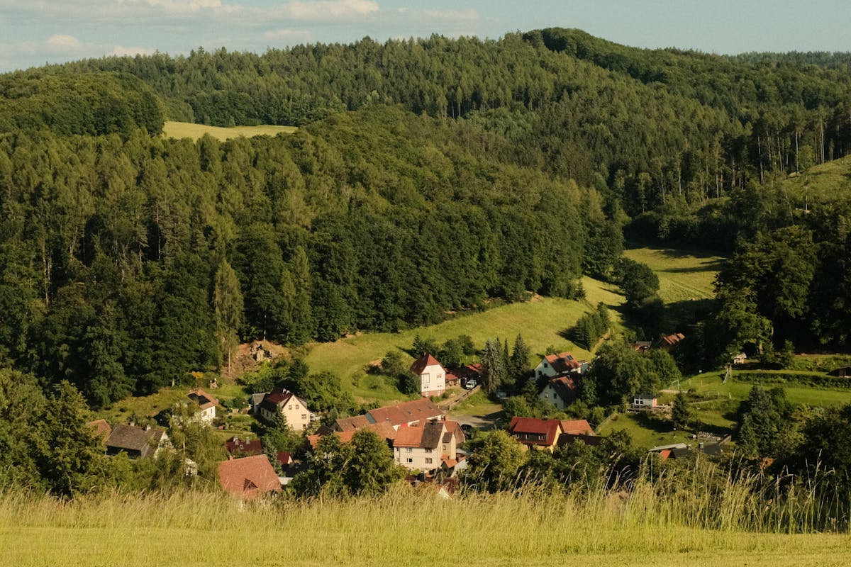 Picturesque village nestled in a green forested landscape in Germany