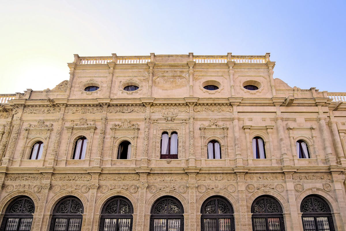 Detailed view of the historic Seville City Hall showcasing Plateresque architecture