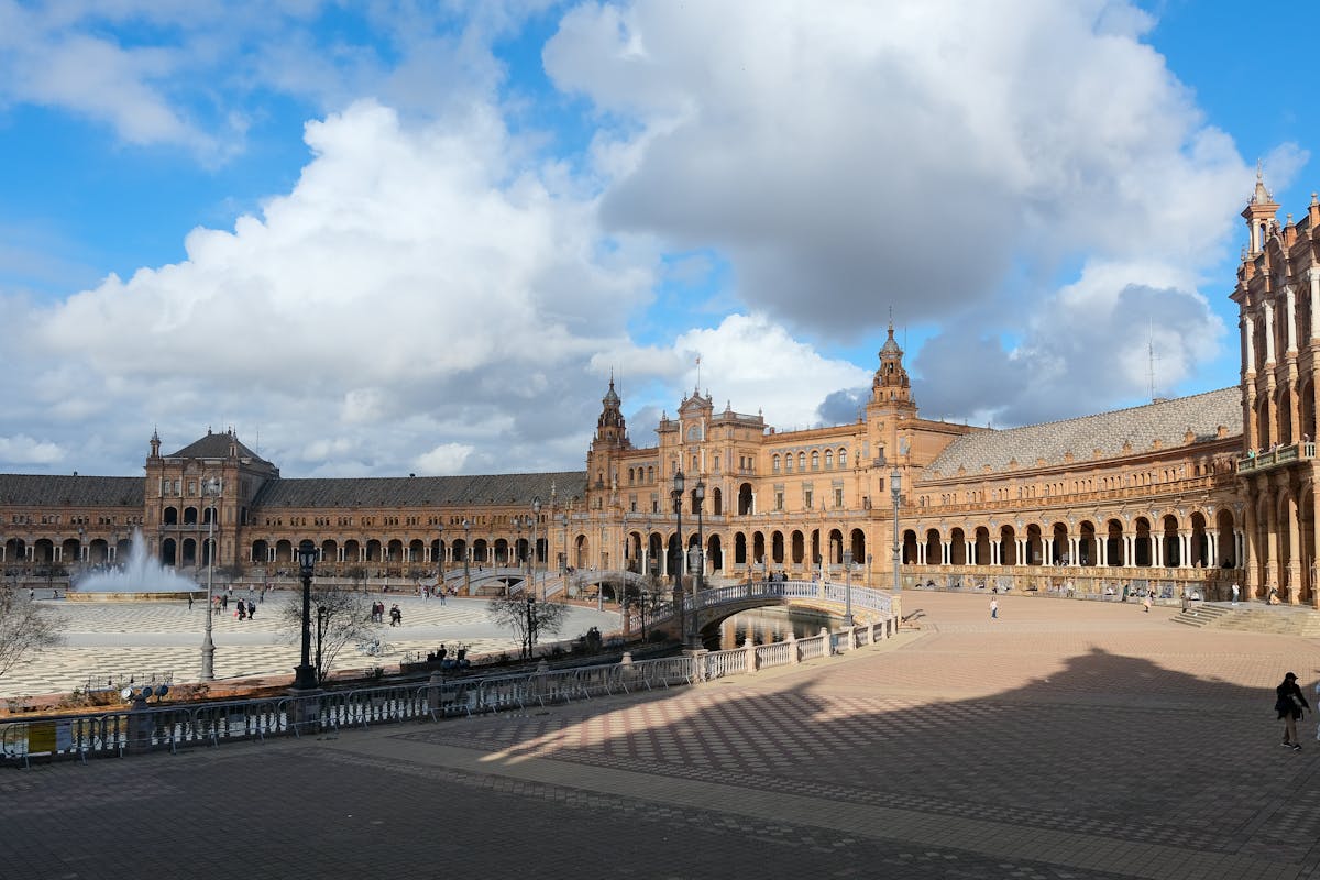 Sunny view of Plaza de Espana Seville architectural landmark with central fountain