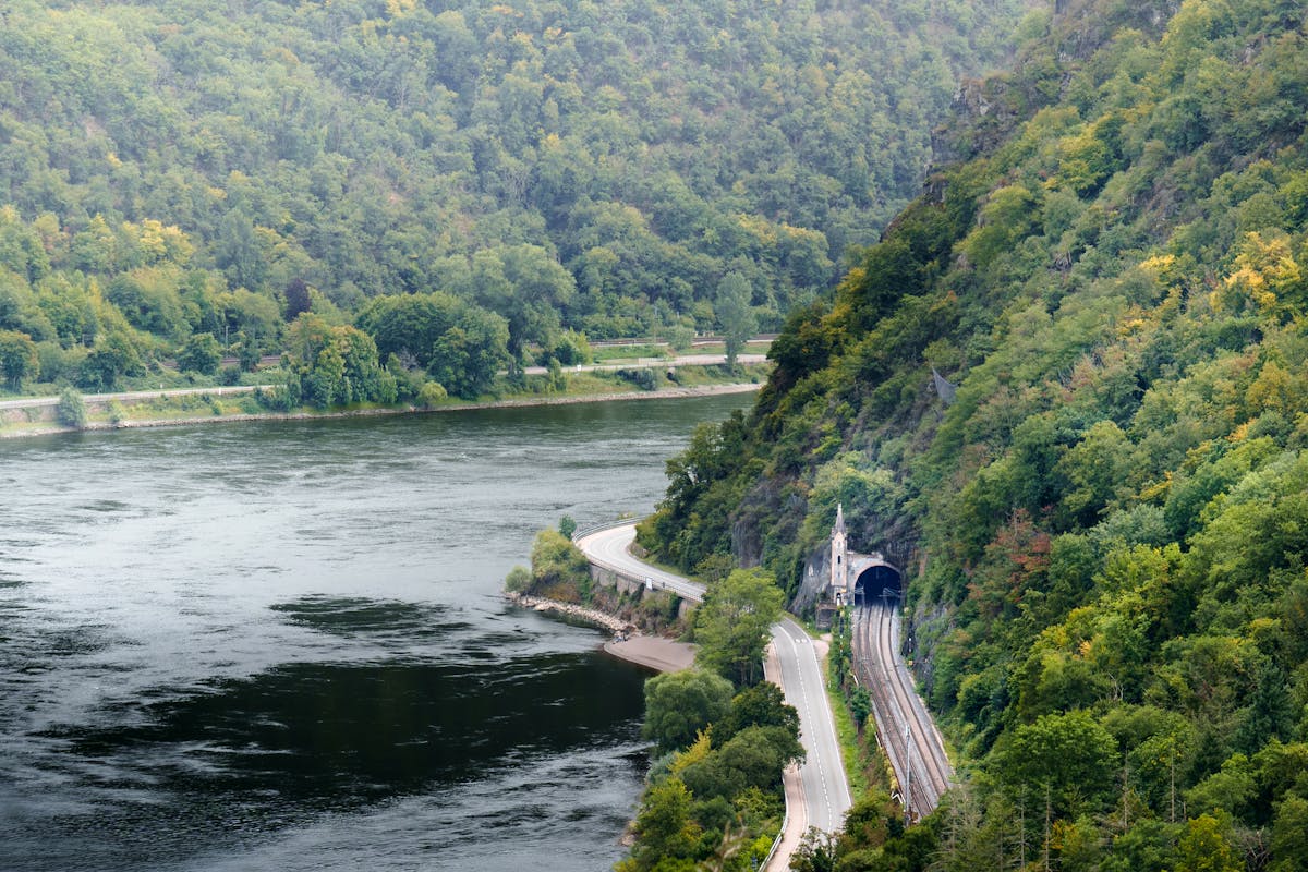 Aerial view of the Rhine River winding through green hills