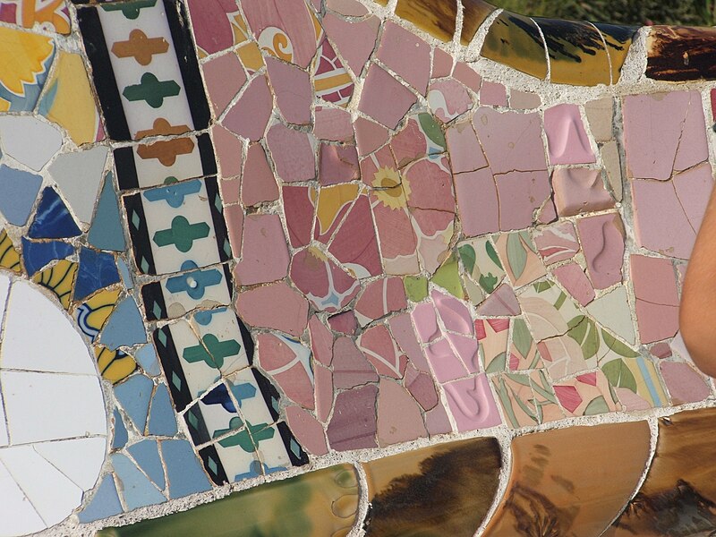 Colorful sun medallion mosaic ceiling design at Park Guell