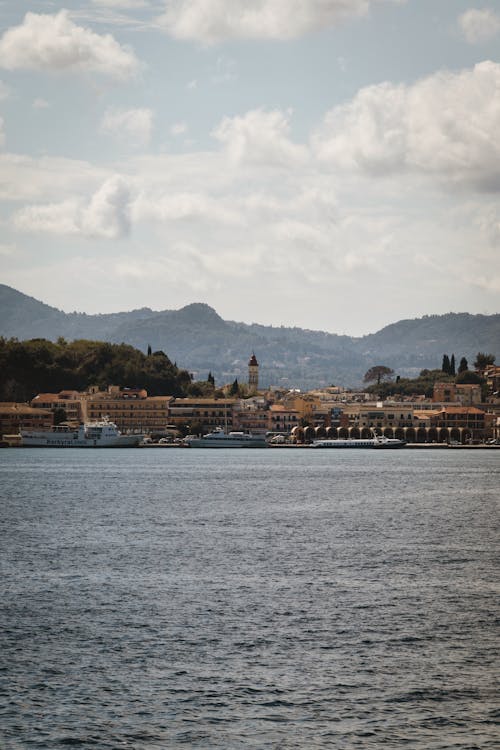Picturesque view of Corfu Town with mountains and Ionian Sea in Corfu, Greece.