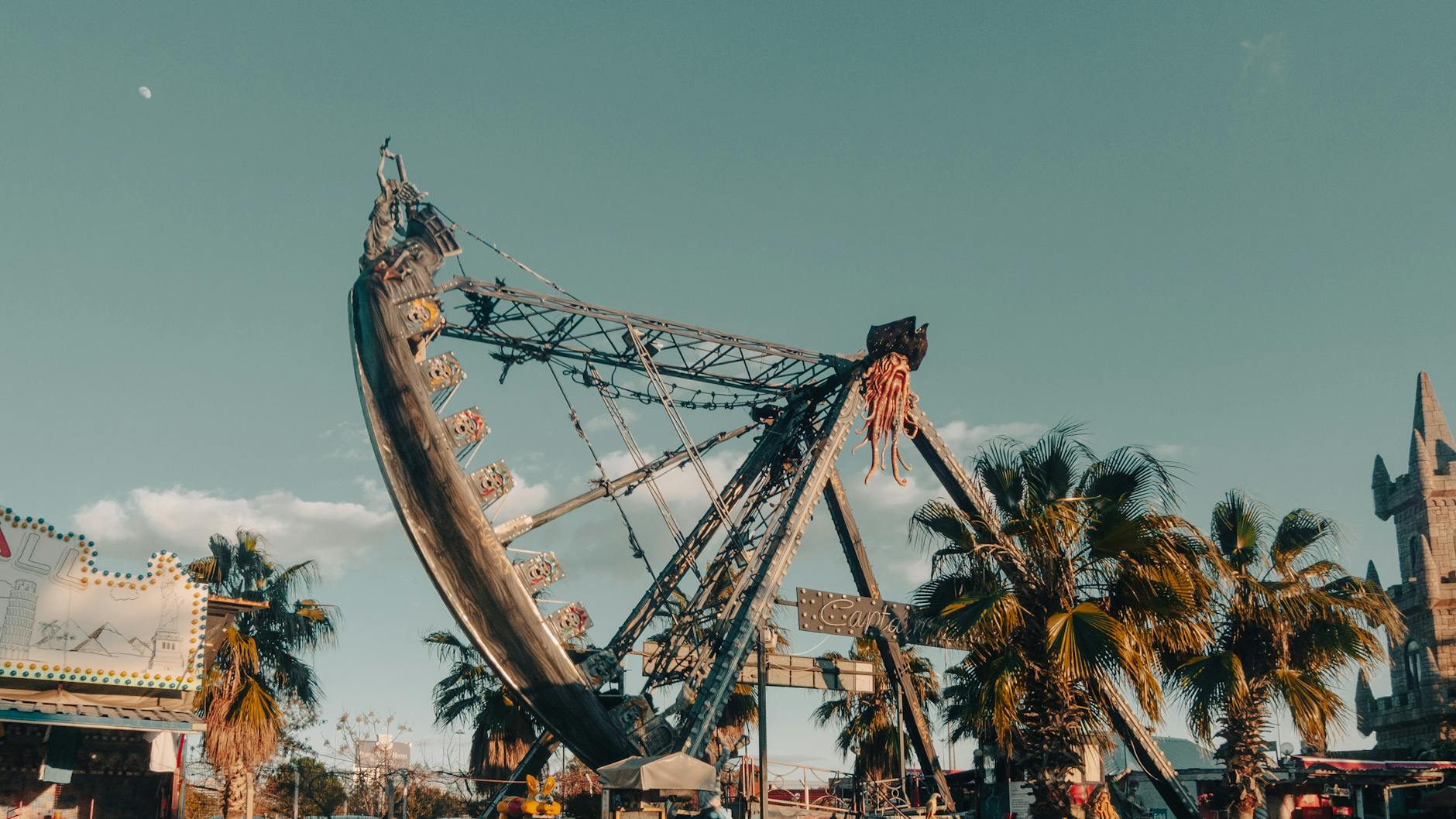 Pirate ship ride at sunset in an amusement park