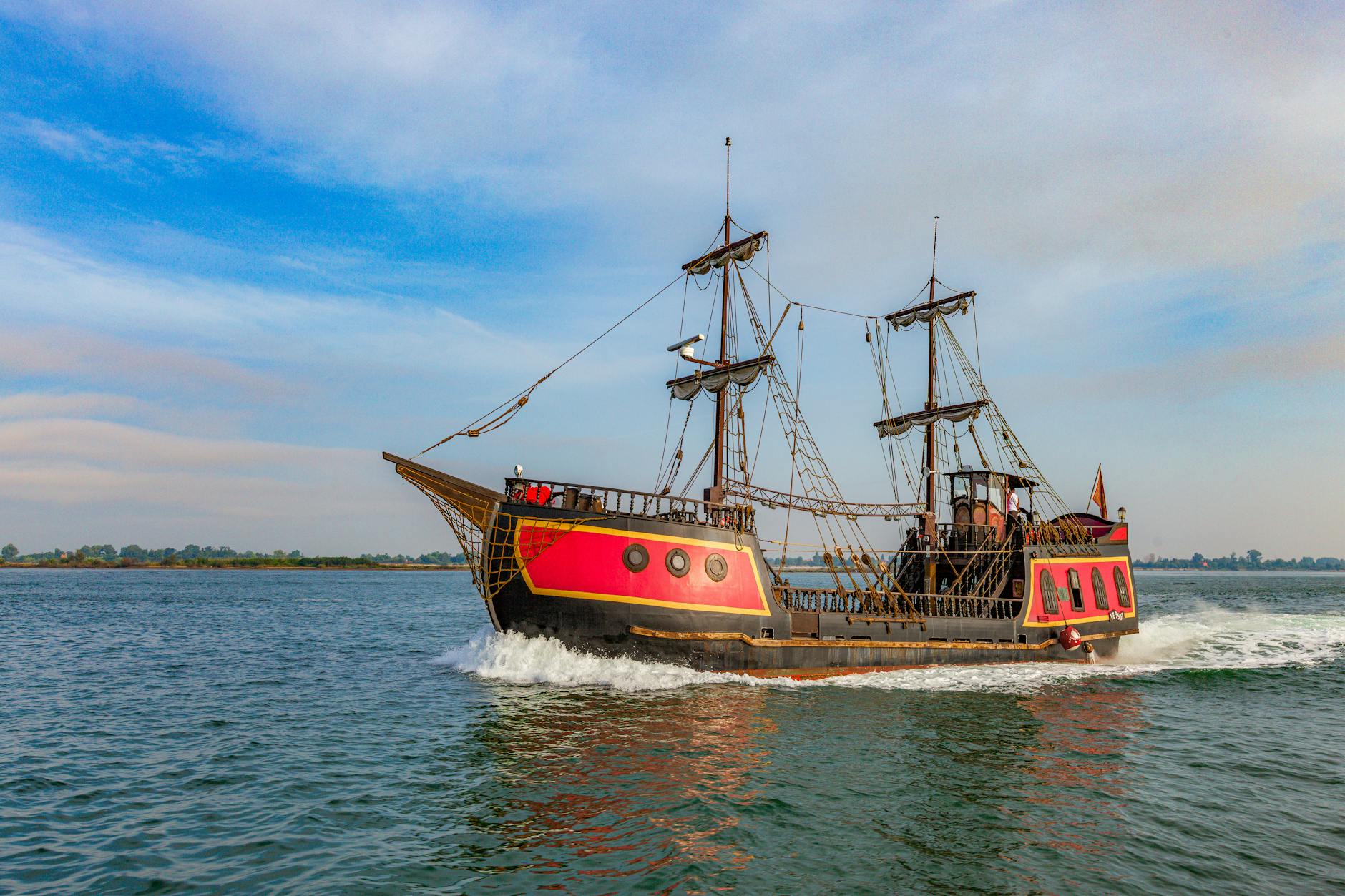 Colorful pirate ship sailing on a clear day