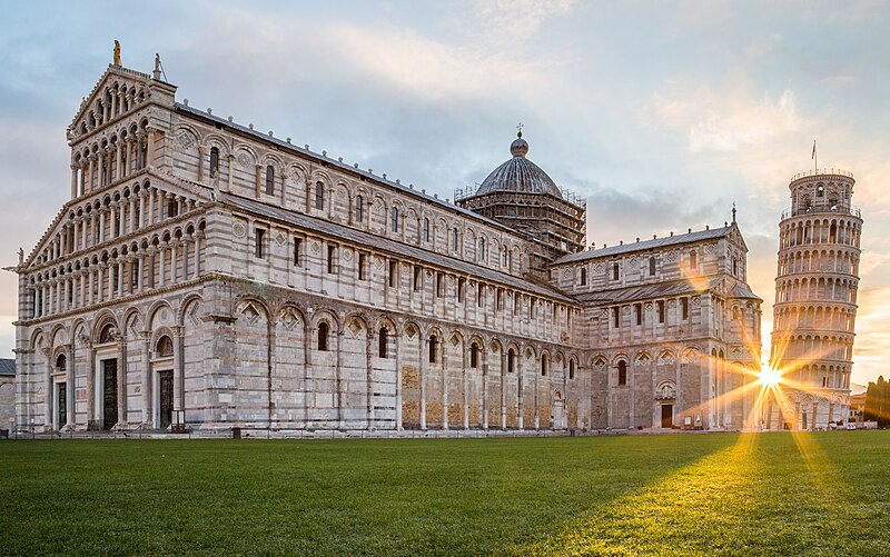 Pisa Cathedral and Leaning Tower bathed in warm sunrise light