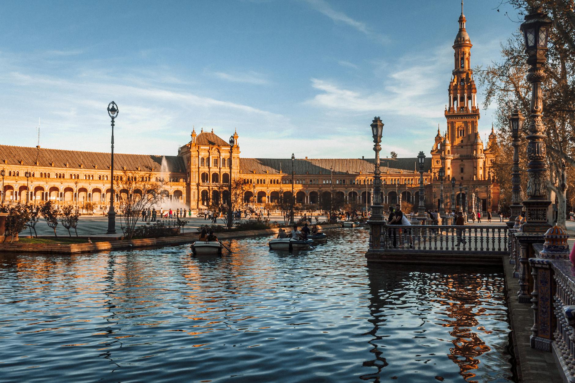 Plaza de Espana in Seville with canal reflections at sunset