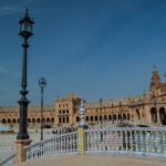 Grand semicircular architecture of Plaza de Espana in Seville with its iconic fountain and canal