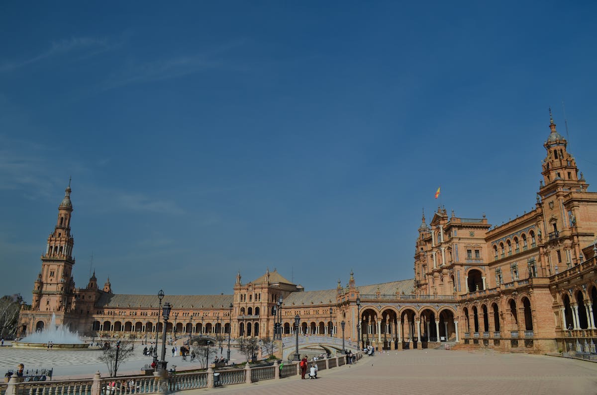 Grand architecture of Plaza de Espana in Seville showing the full semicircular building
