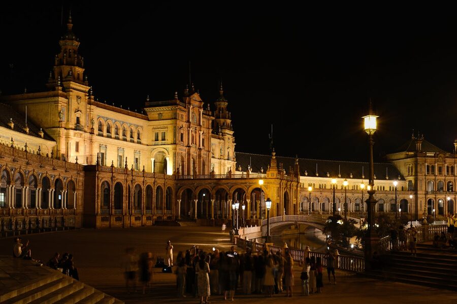 Stunning night view of Plaza de Espana in Seville showcasing its ornate architecture