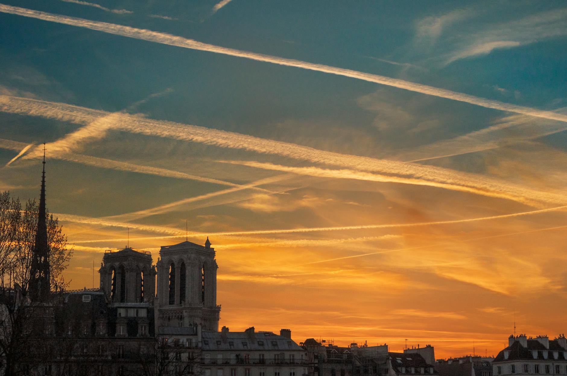 Notre-Dame Cathedral at sunset along the Seine in Paris
