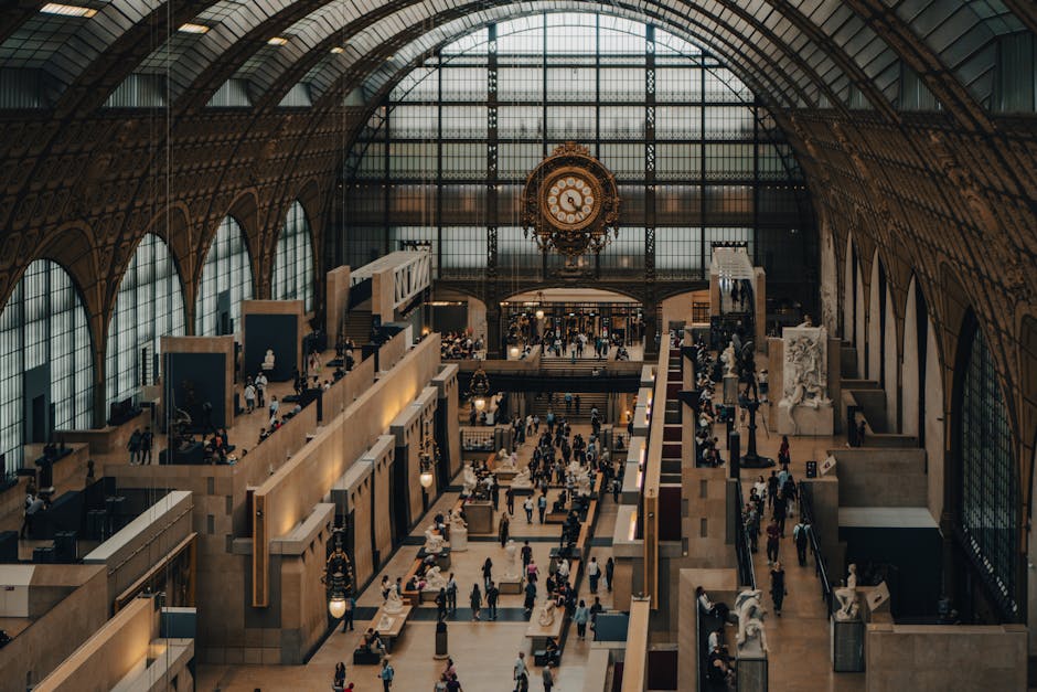 Visitors inside the grand hall of the Musee d'Orsay