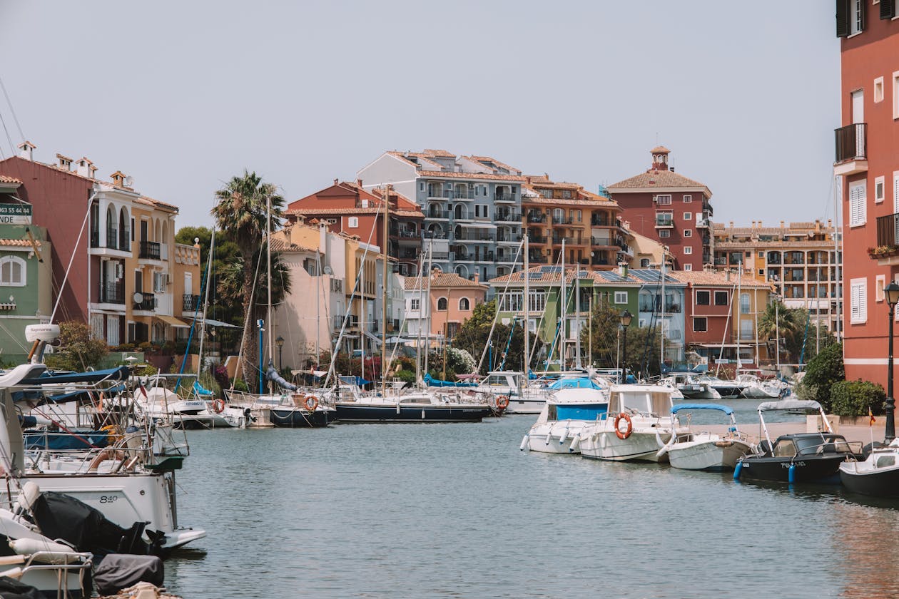 Colorful buildings and boats in the Port Saplaya neighborhood of Valencia Spain