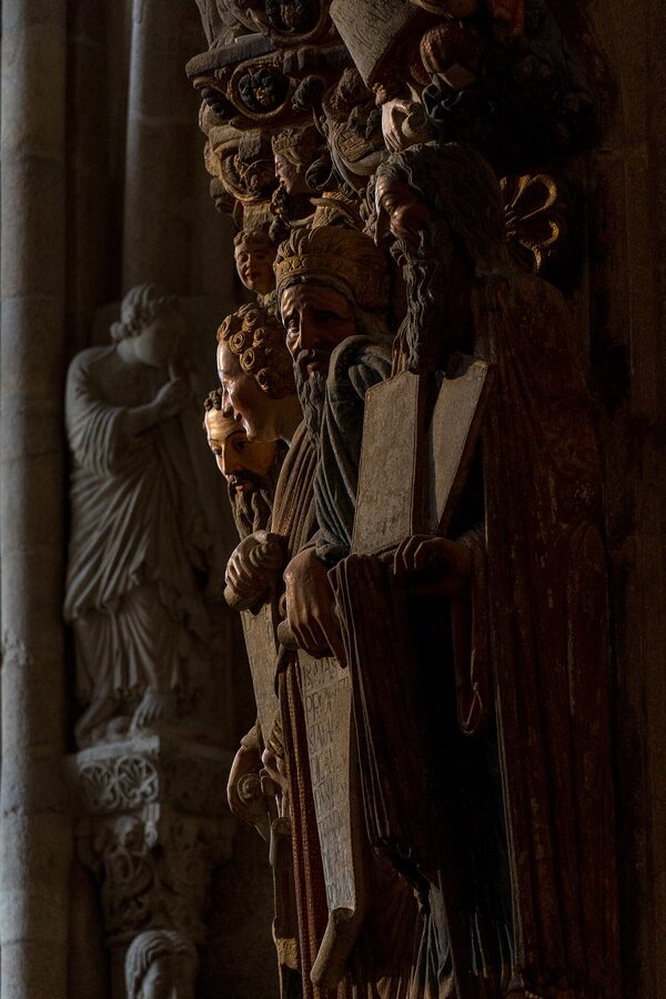 Carved stone figures on the Portico de la Gloria inside Santiago Cathedral
