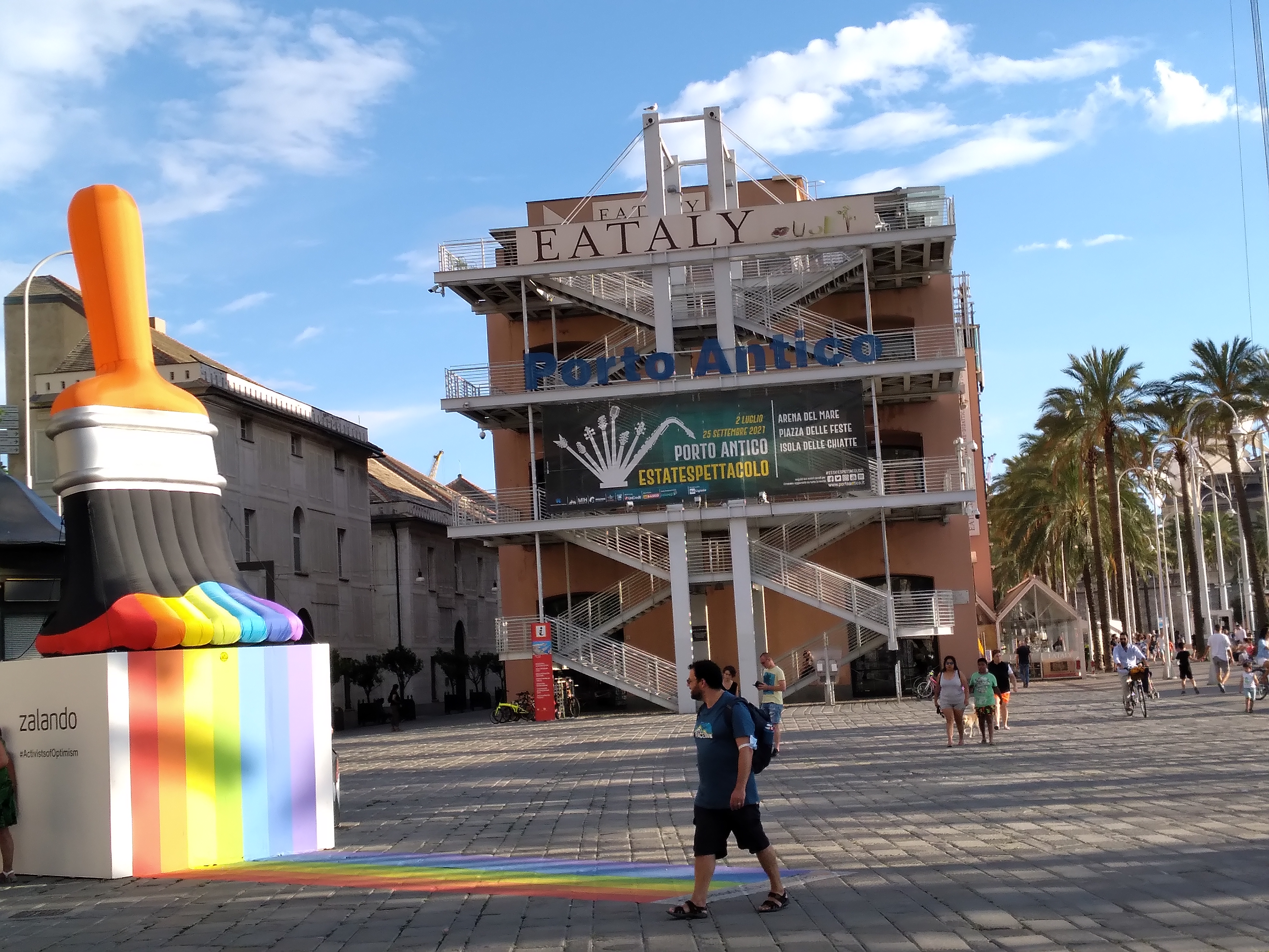 The Porto Antico waterfront area with boats and the Genoa skyline