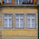 Colorful building facades with traditional Portuguese azulejo tiles in Porto old town