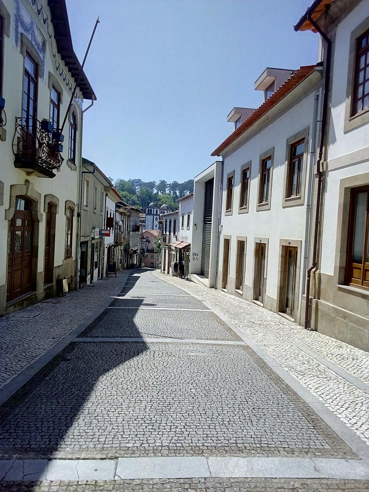 Traditional Portuguese cobblestone street with colorful buildings
