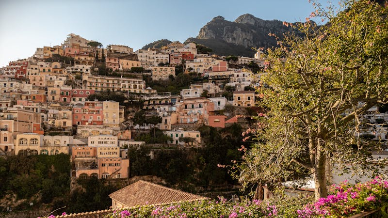 Scenic view of Positano colorful buildings on the Amalfi Coast bathed in warm sunset light