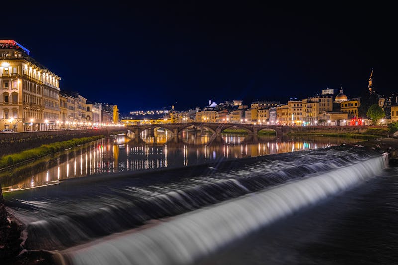 Florence Arno River at night with illuminated buildings