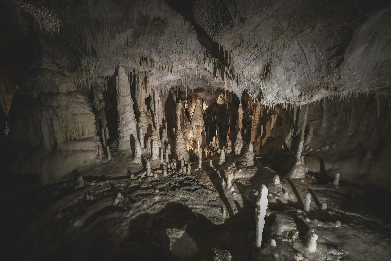 Cave interior with stalactites and stalagmites formations