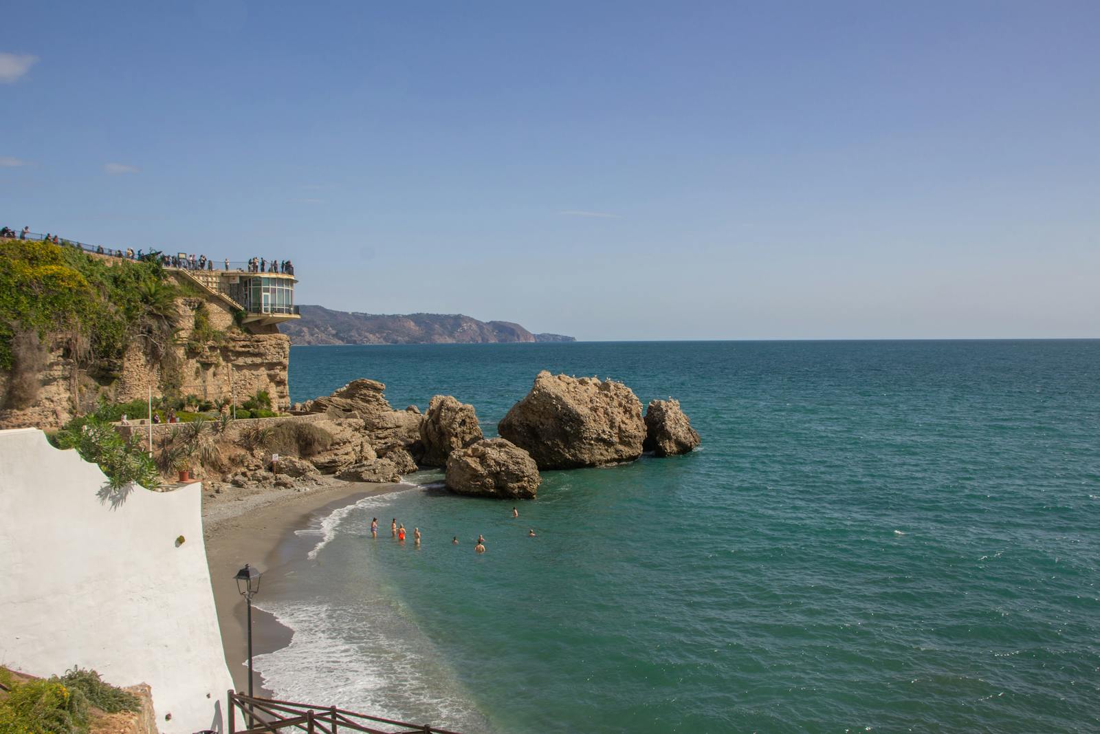 View from Balcon de Europa in Nerja with beach and rocky shoreline