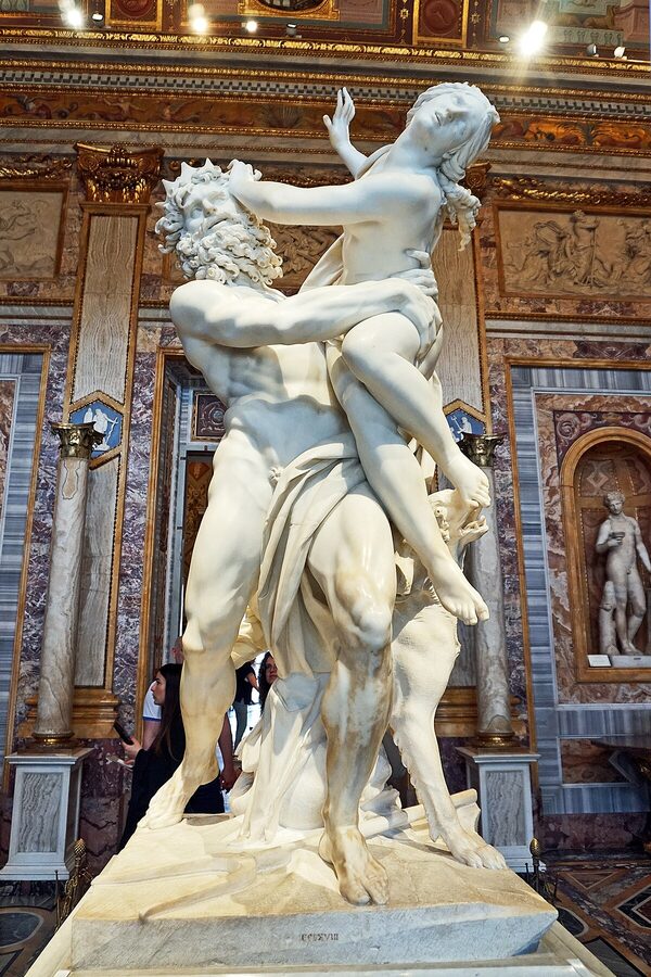 The Rape of Proserpina marble sculpture by Bernini showing Pluto grasping Proserpina in the Galleria Borghese