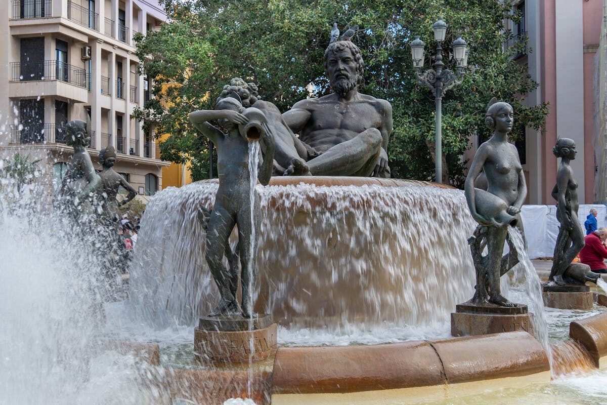 Detailed Neptune fountain with flowing water and intricate sculptures in Valencia