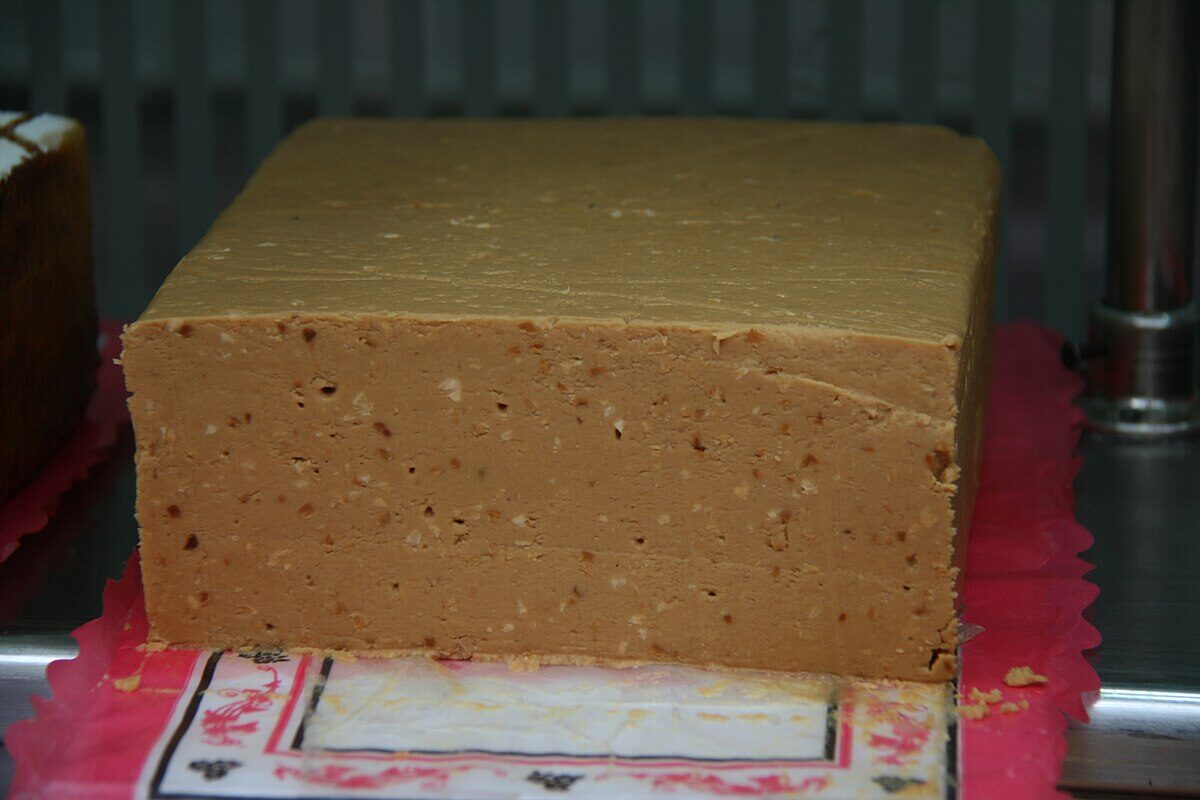 Traditional soft turron de Jijona Spanish almond nougat confection sliced and served