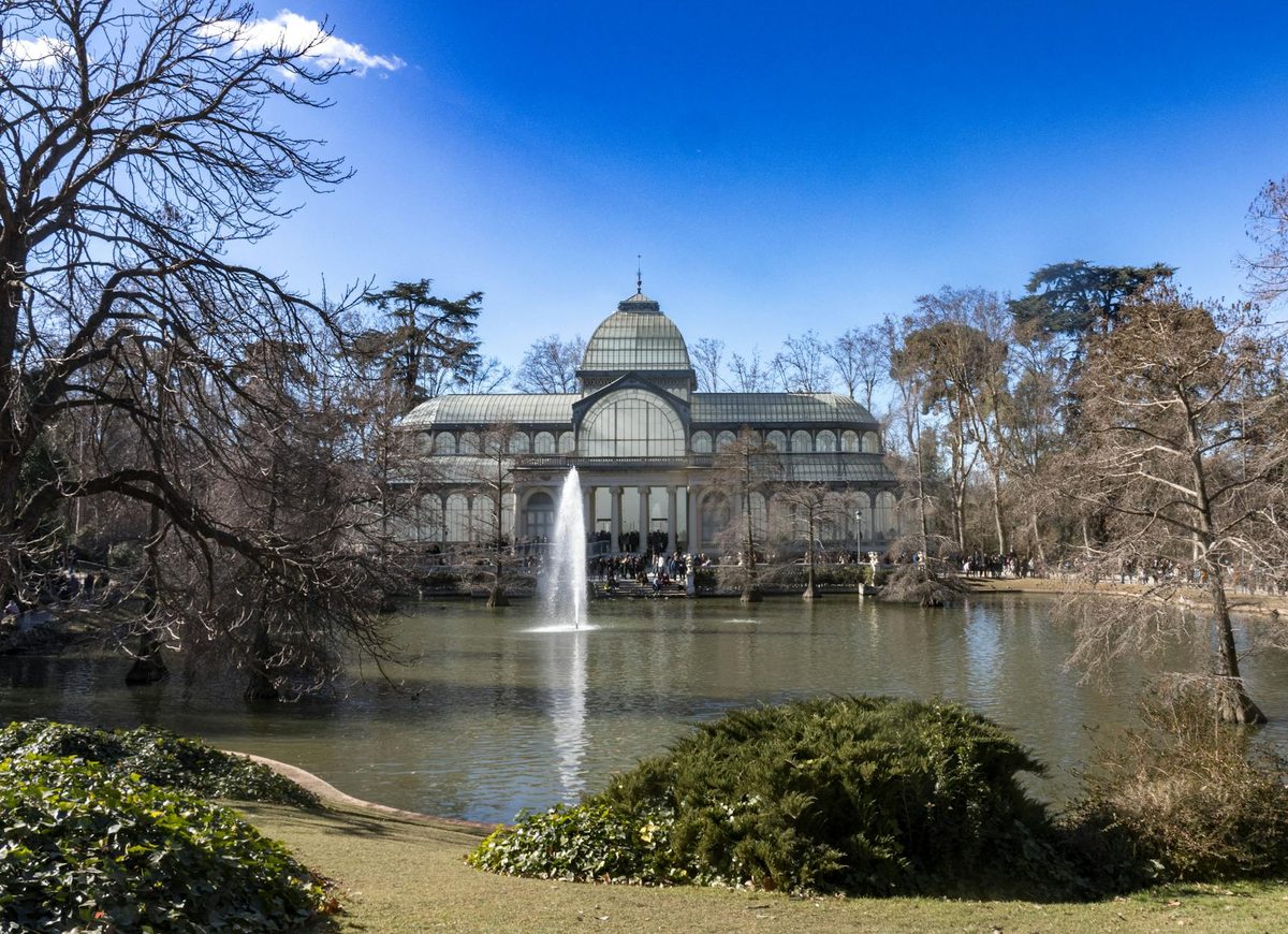 The Crystal Palace in Retiro Park Madrid with reflecting pool