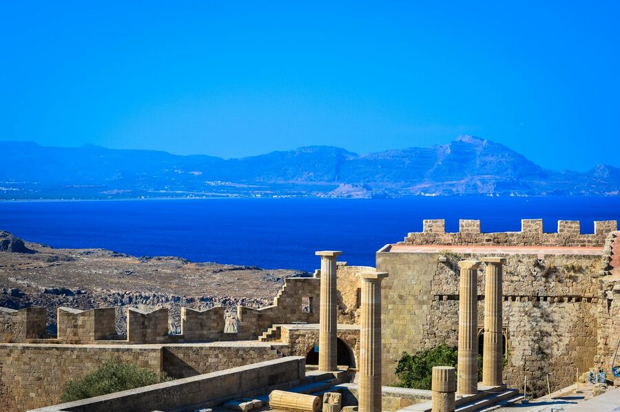 Scenic view of ancient Greek ruins with stone columns