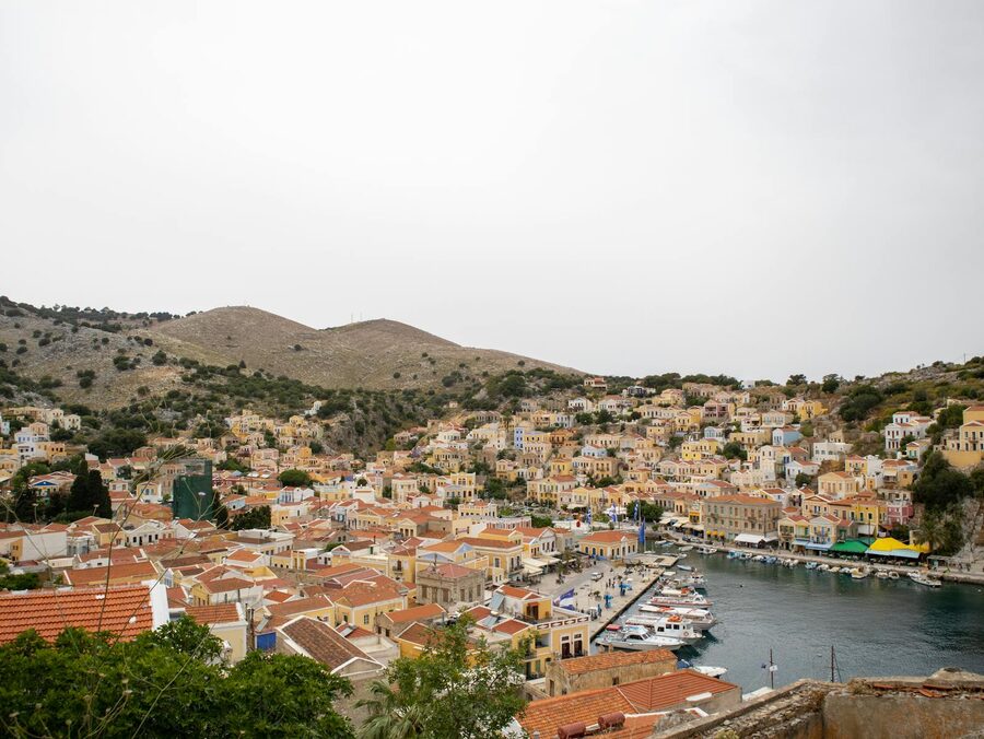 Symi Island harbor and surrounding pastel houses