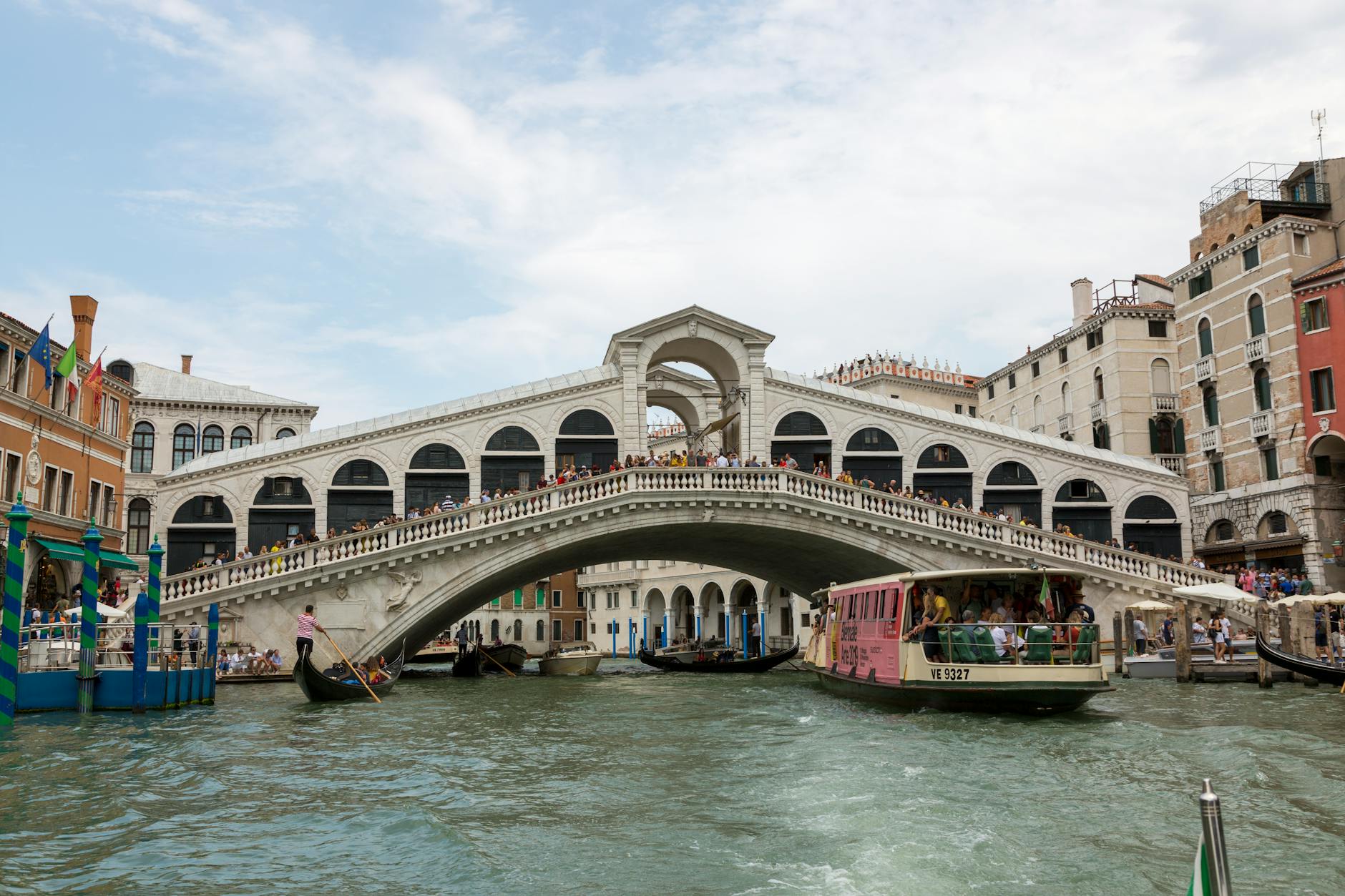 Iconic Rialto Bridge spanning the Grand Canal in Venice on a sunny day