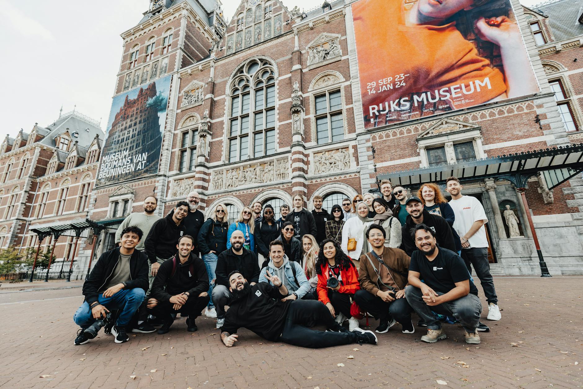 Friends gathered outside the Rijksmuseum entrance on a clear day