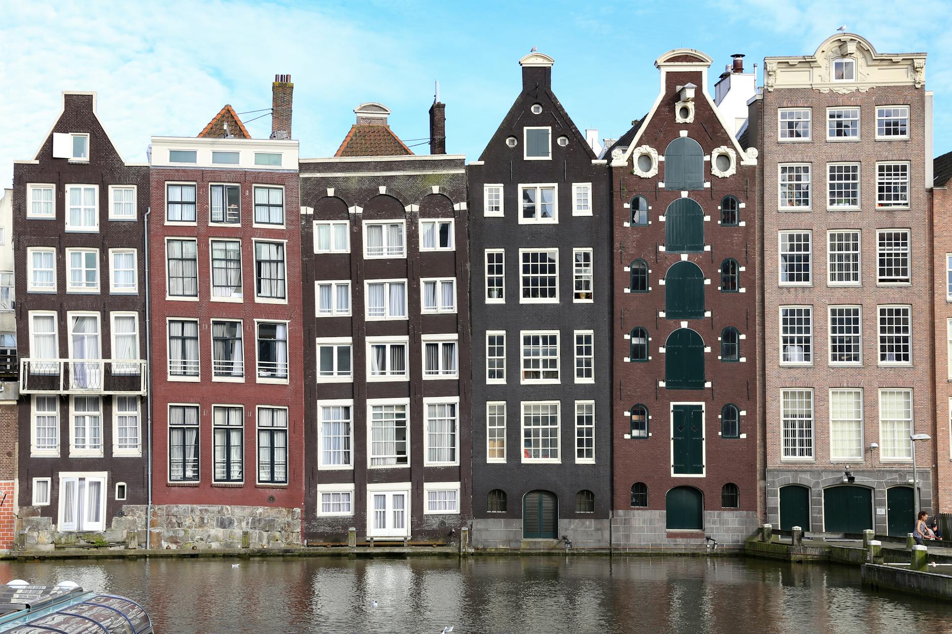 Narrow canal houses in Amsterdam reflecting the city's Golden Age architecture