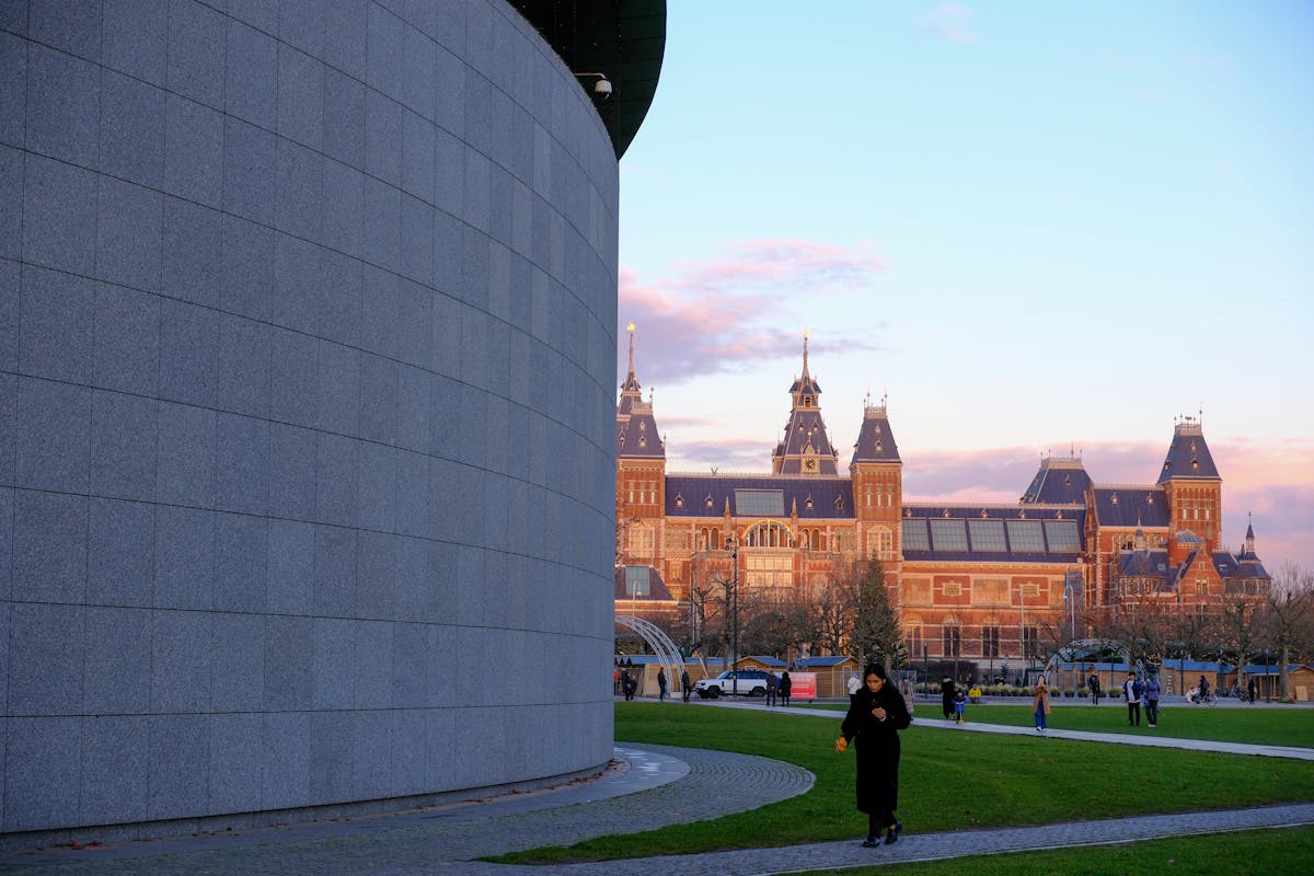 Captivating view of the Rijksmuseum and park at sunset in Amsterdam