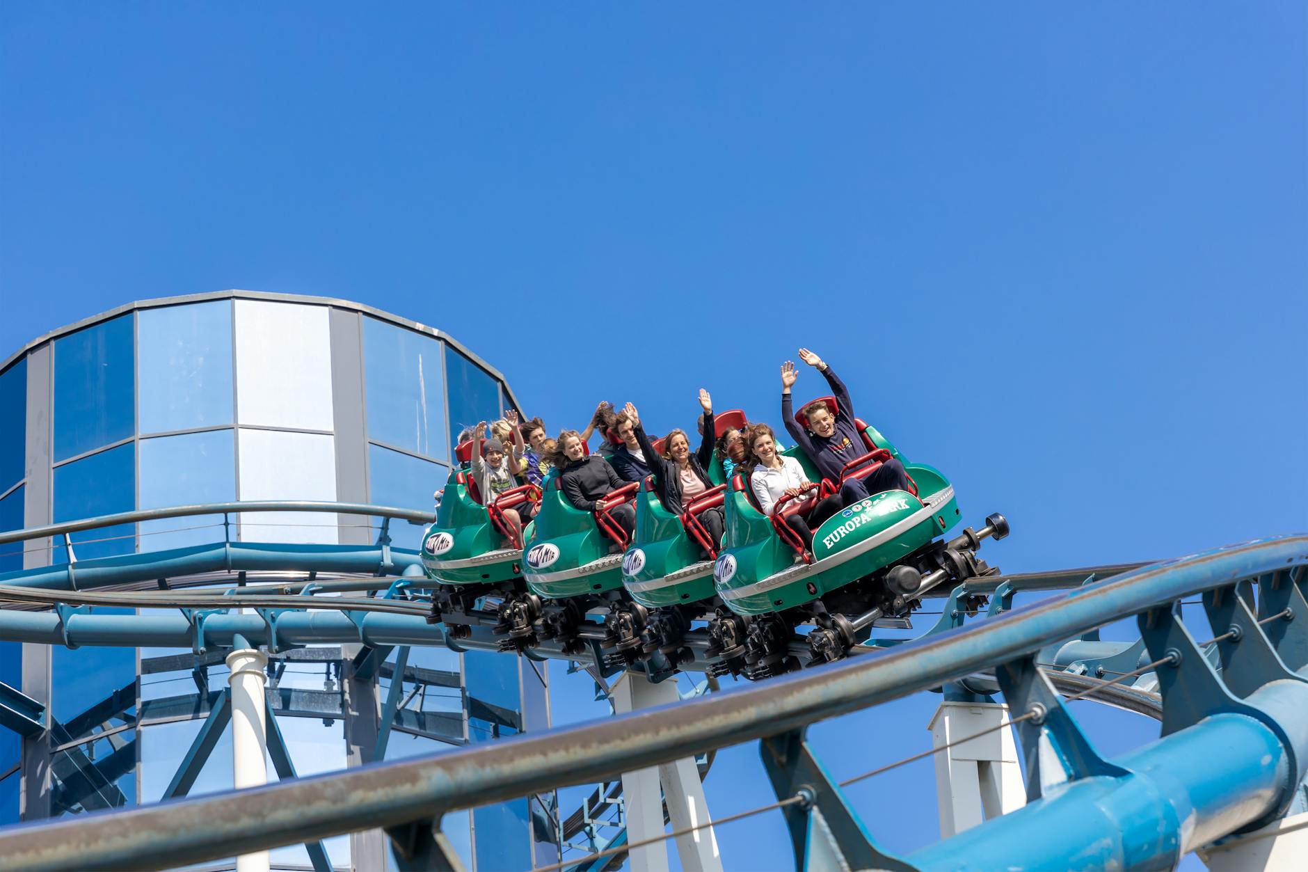 People on a roller coaster ride at a theme park