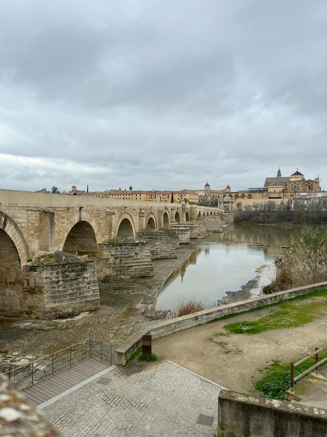 The Roman Bridge of Cordoba spanning the Guadalquivir River with the old town behind