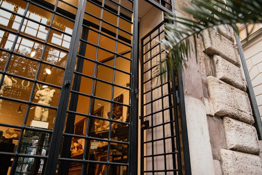 Interior of an art gallery in Rome with paintings displayed on gallery walls