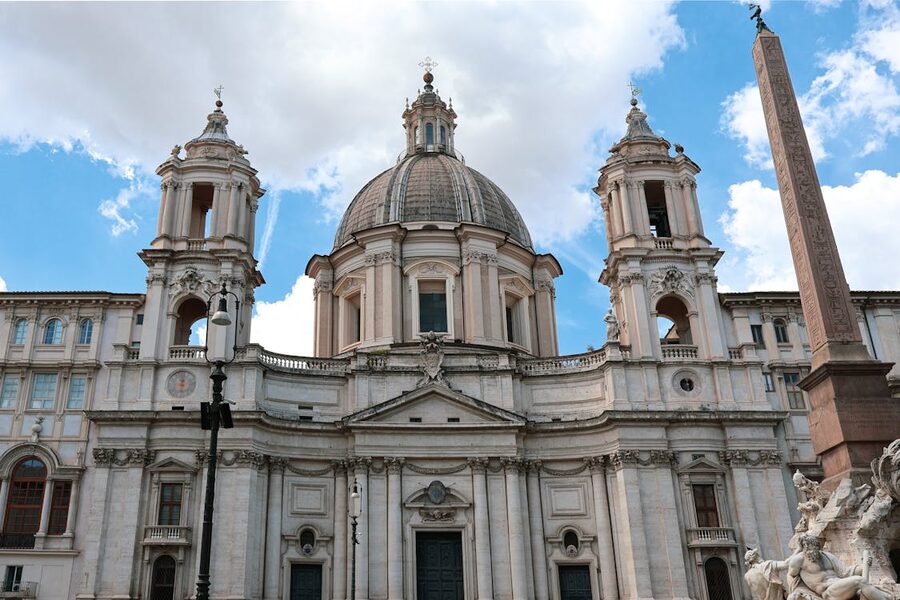 Piazza Navona in Rome at dusk with Baroque fountains and the Church of Sant Agnese