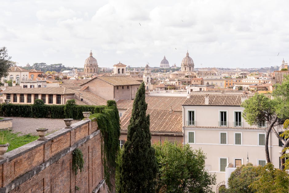 Panoramic view of Rome showing church domes and rooftops of historic buildings