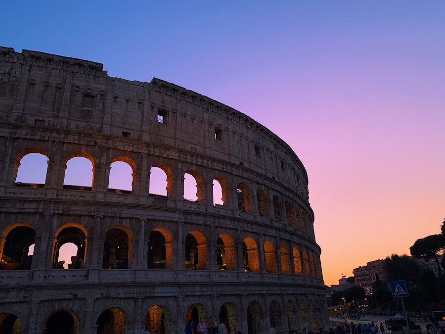 The Colosseum in Rome illuminated by a stunning sunset